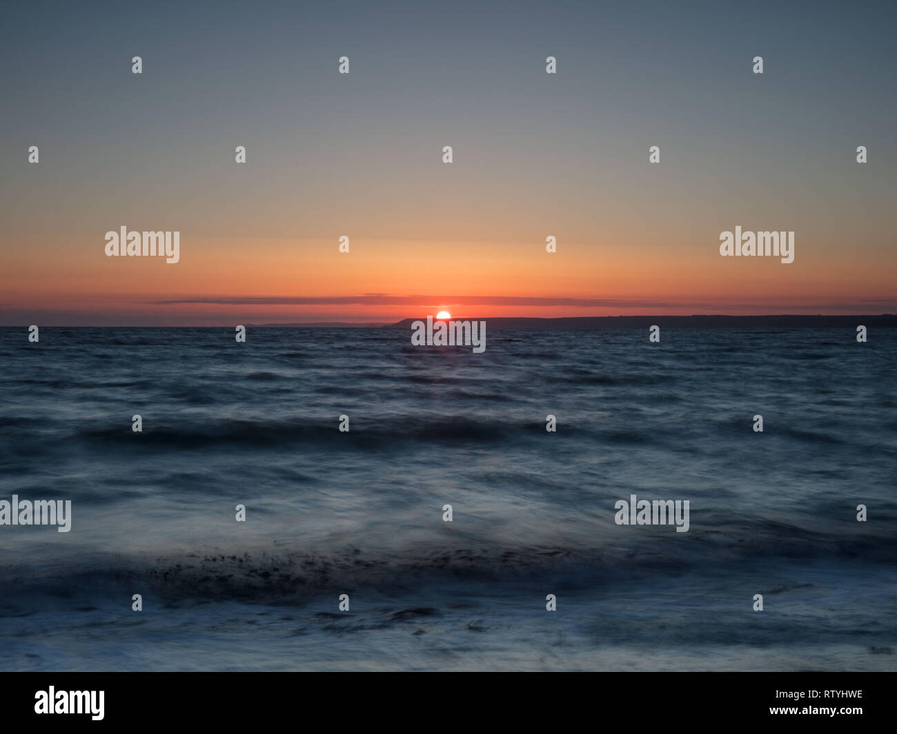 A late evening sunrise in South Devon. This beautiful spot in Hope Cove ...