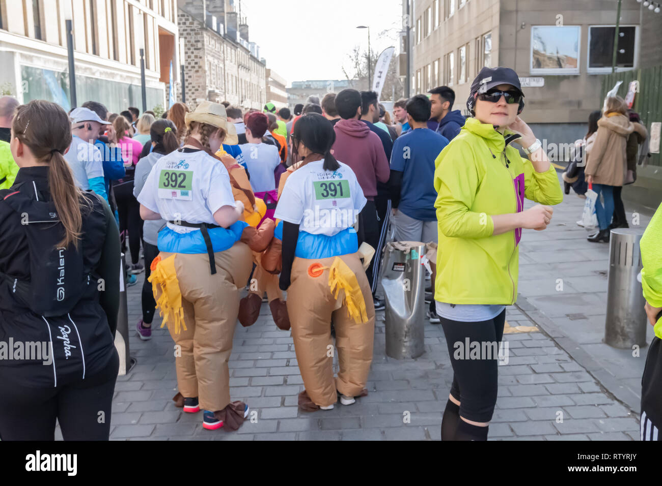 Edinburgh, Scotland, UK. 3rd March, 2019. Two female runners wearing ...
