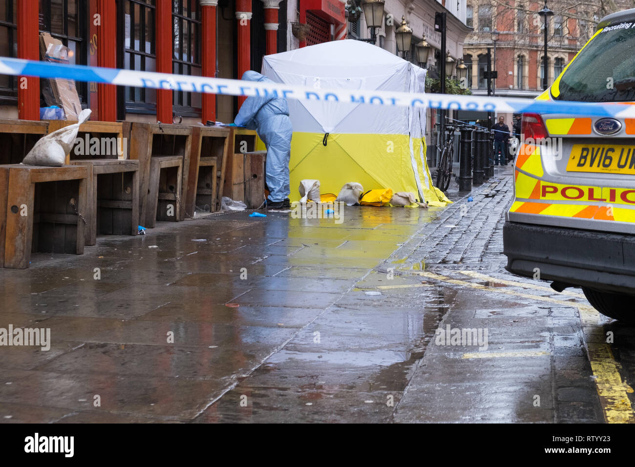 Soho, London, UK - March 3, 2019: A forensic officer at the crime scene ...