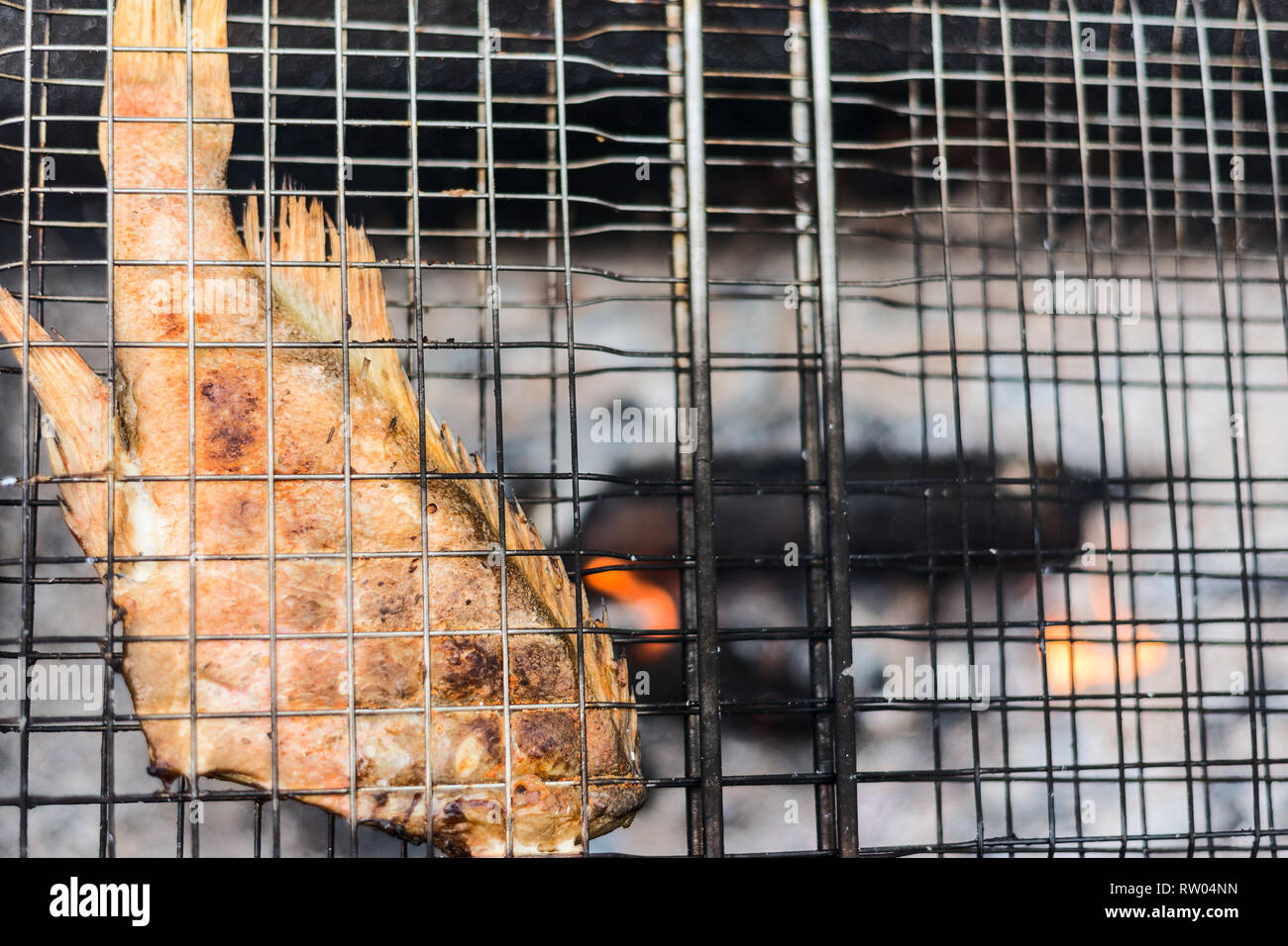 Flame grilled fish hi-res stock photography and images - Alamy