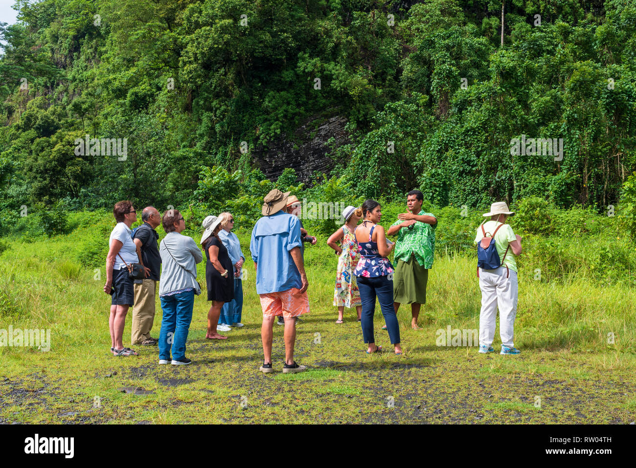 Tahiti Rain Forest, French Polynesia — March 18, 2018. A tour guide ...