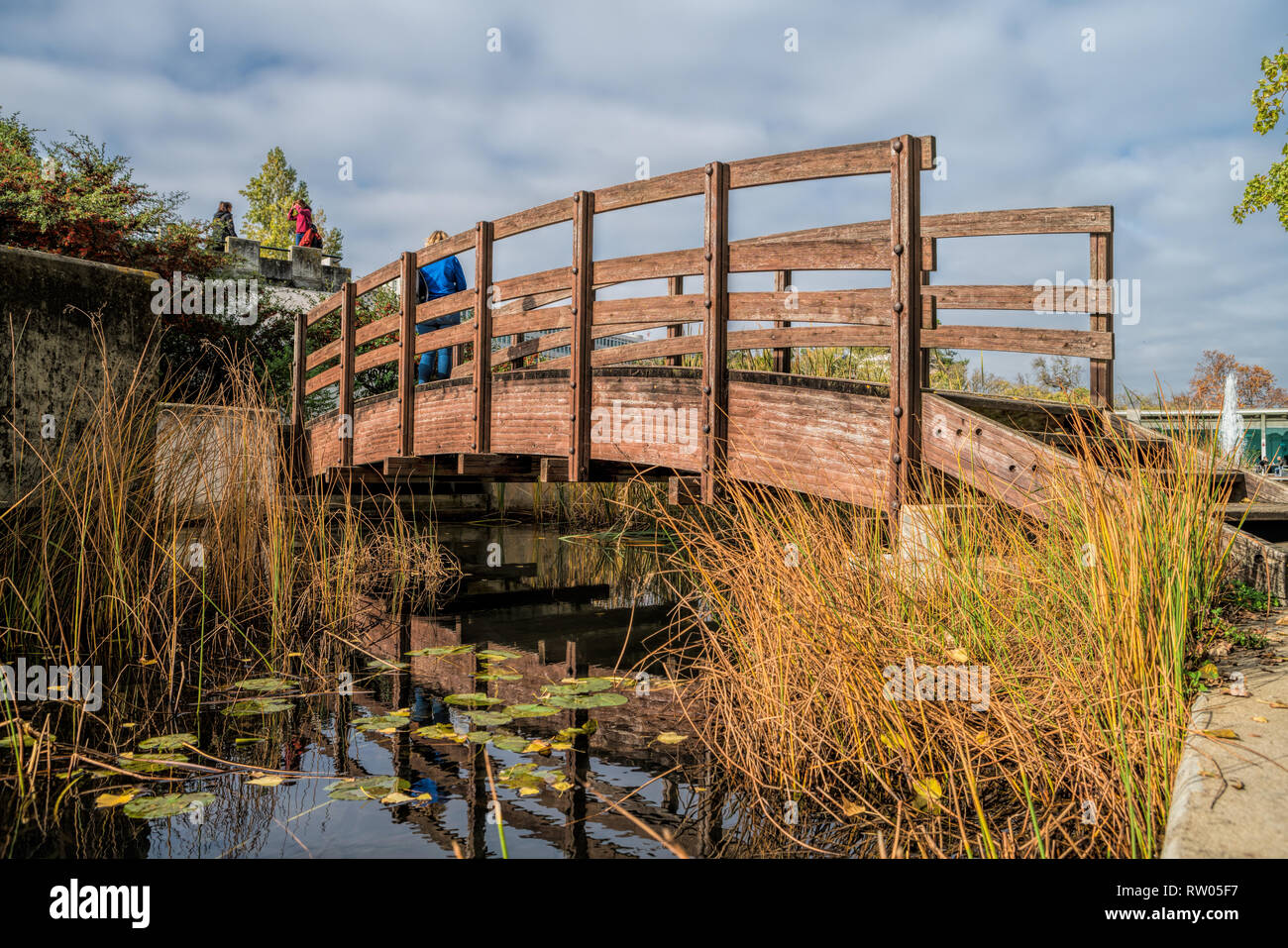 Beautiful wooden bridge across river Stock Photo - Alamy