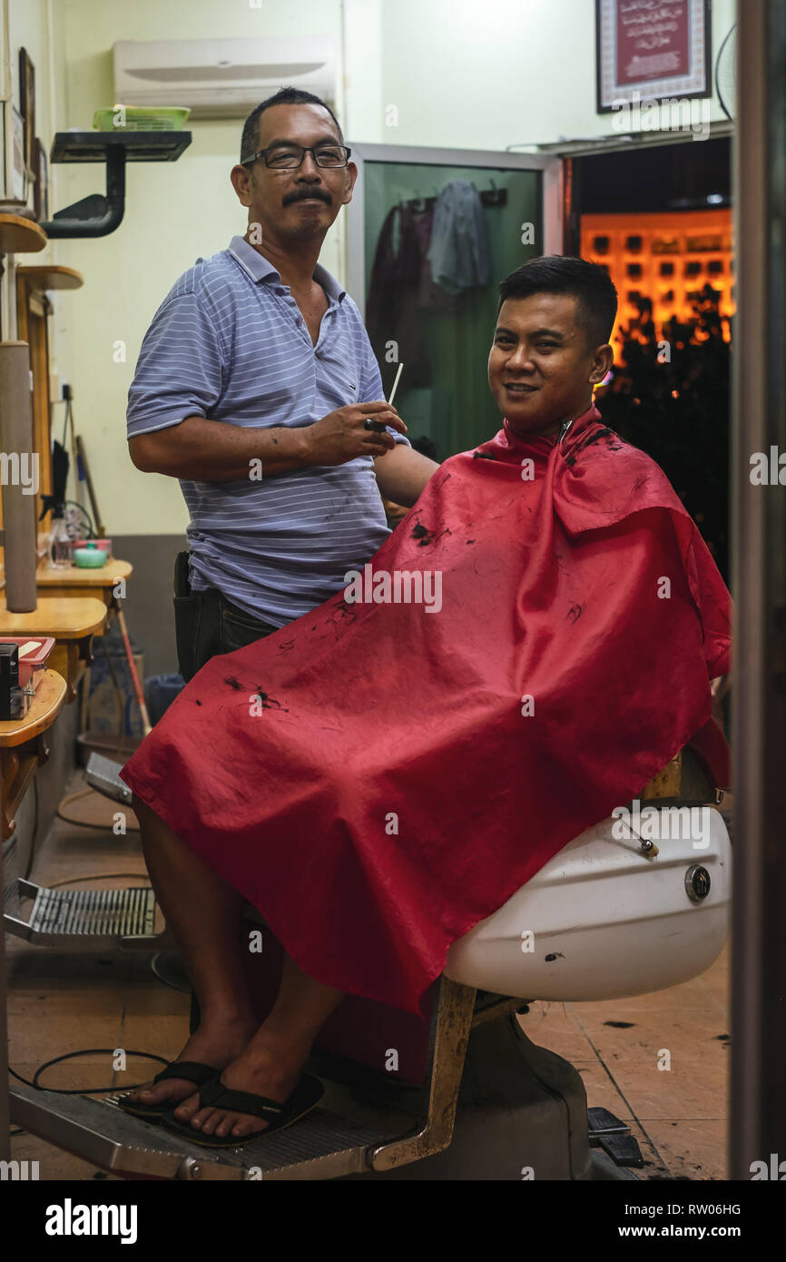 KUCHING / SARAWAK / MALAYSIA / JUNE 2014: Barber shop in the streets of ...