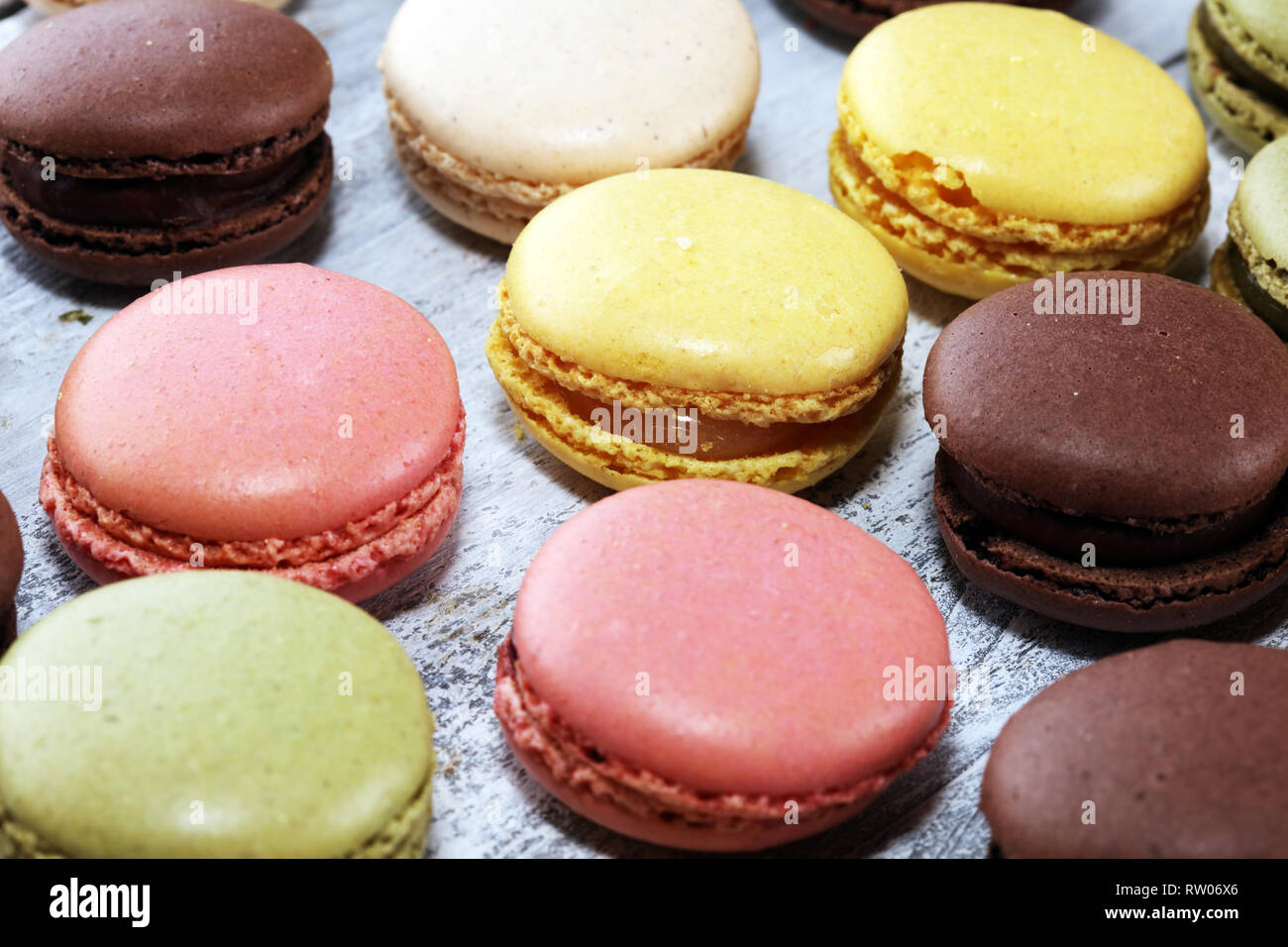 Sweet and colourful french macaroons or macaron on white background ...
