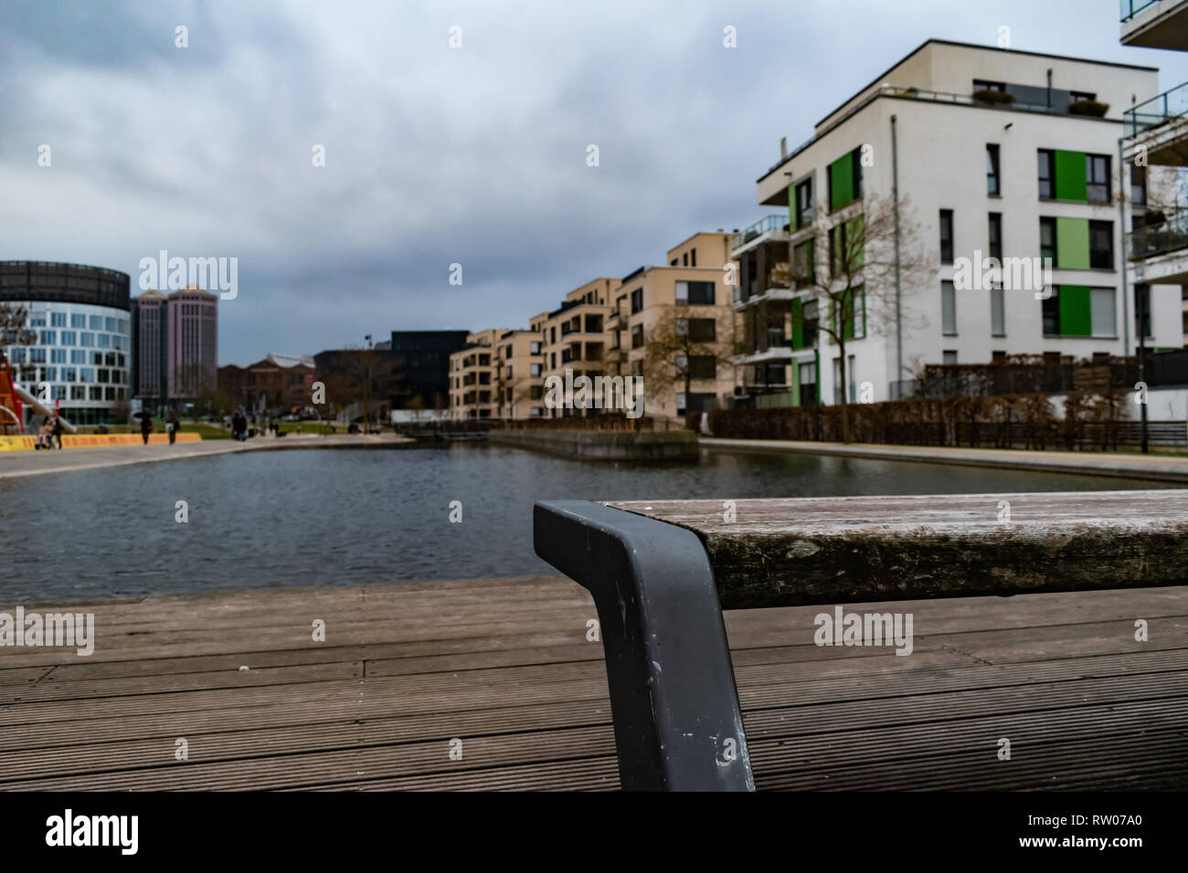 Depth of field view over park and apartments from bench Stock Photo - Alamy
