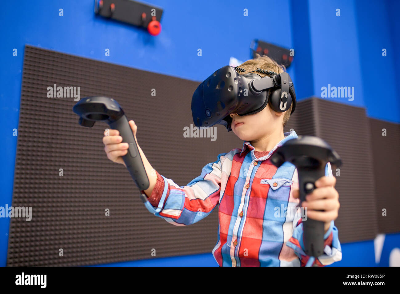 modern technology, gaming and people concept - boy in virtual reality ...