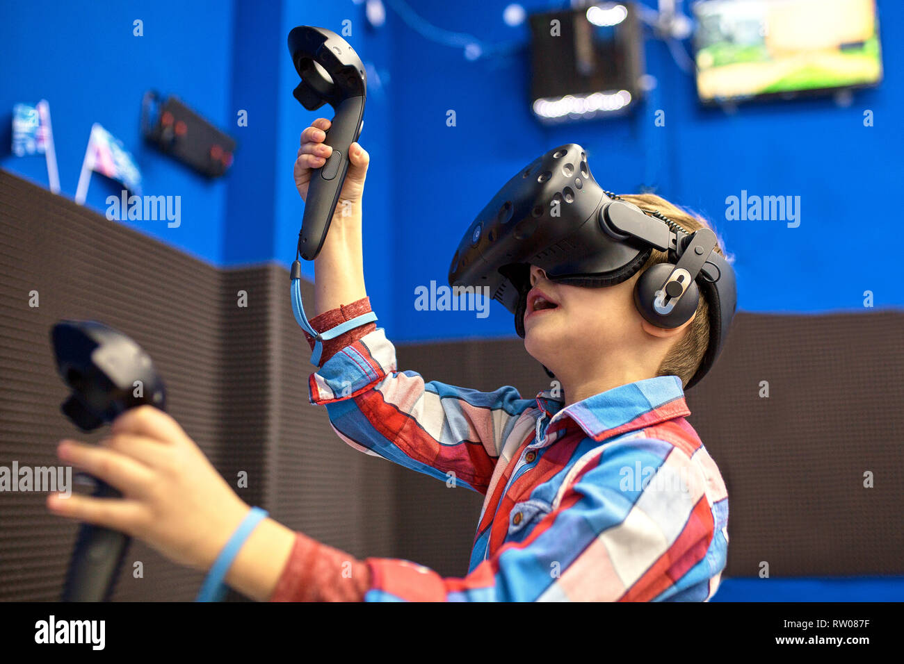 modern technology, gaming and people concept - boy in virtual reality ...