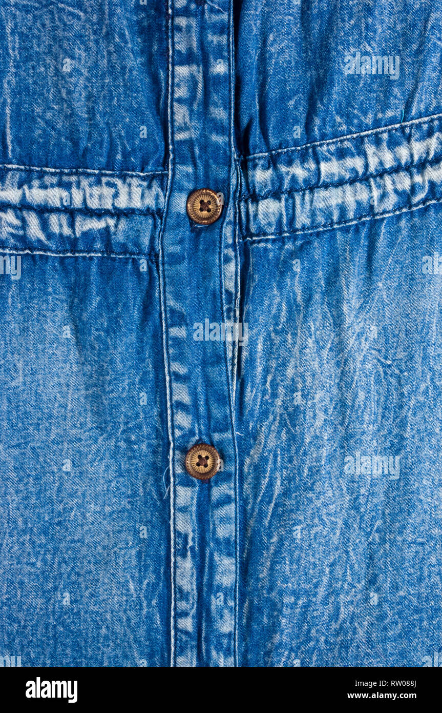 Blue washed faded jeans texture with seams, clasps, buttons and rivets ...