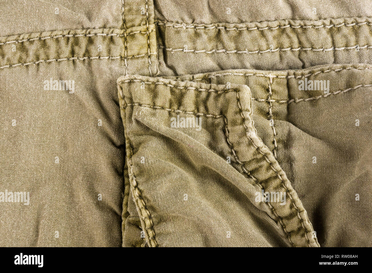 clothing items washed cotton fabric texture with seams, macro, close-up ...