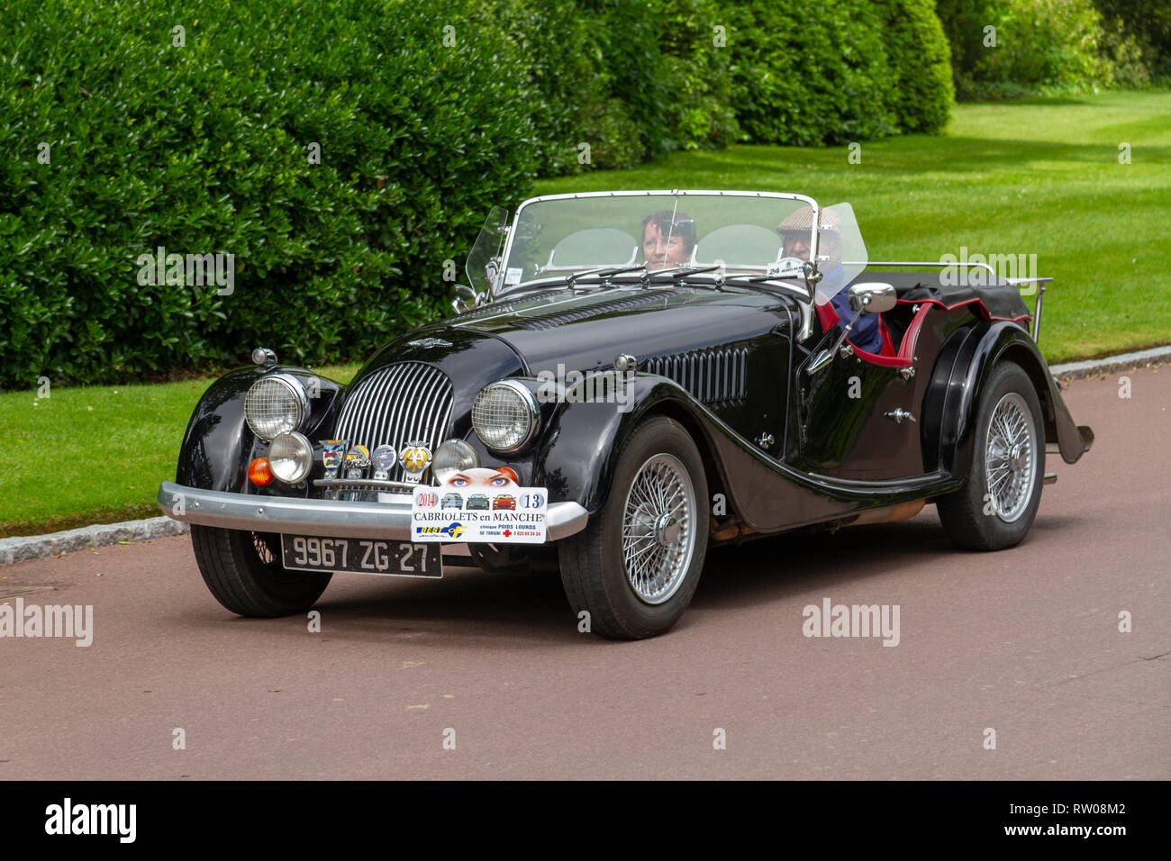 A vintage Morgan roadster exciting the Normandy American Cemetery and ...