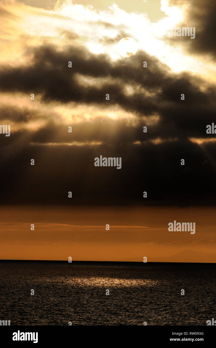 Sunset over the Irish sea from Peel, a small fishing town on the west ...