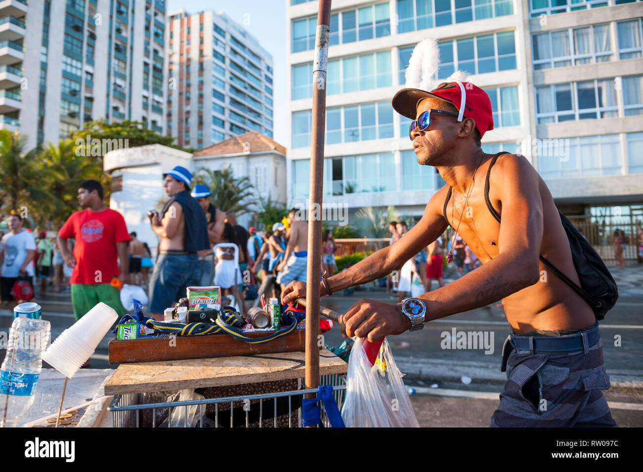 RIO DE JANEIRO - FEBRUARY 28, 2017: A Brazilian street vendor pushes a ...