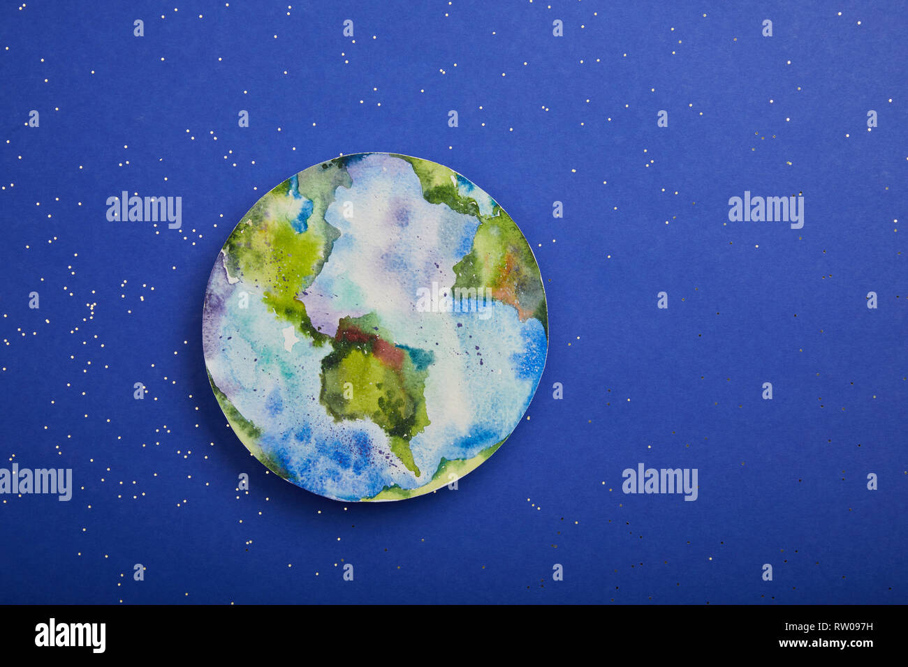 top view of planet picture on violet background with stars, earth day ...