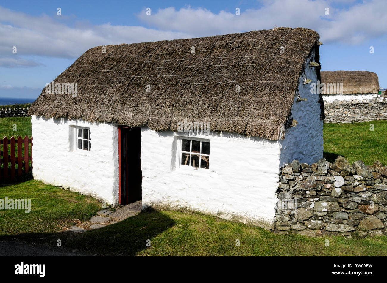A restored thatched roof Manx cottage at the National Folk Museum in a ...