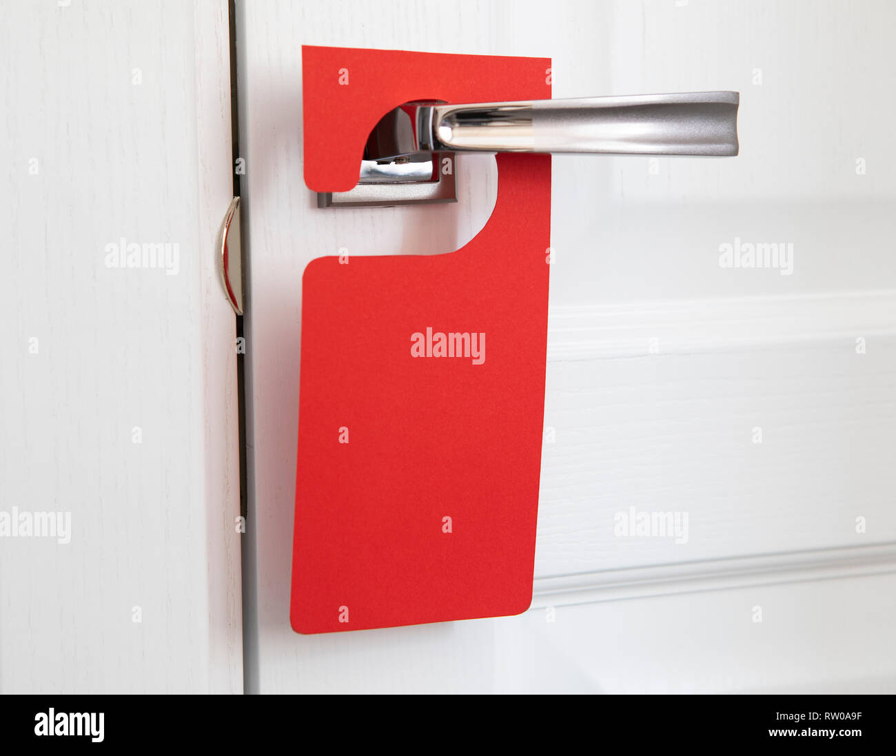 Hotel door handle with blank paper hanger Stock Photo - Alamy