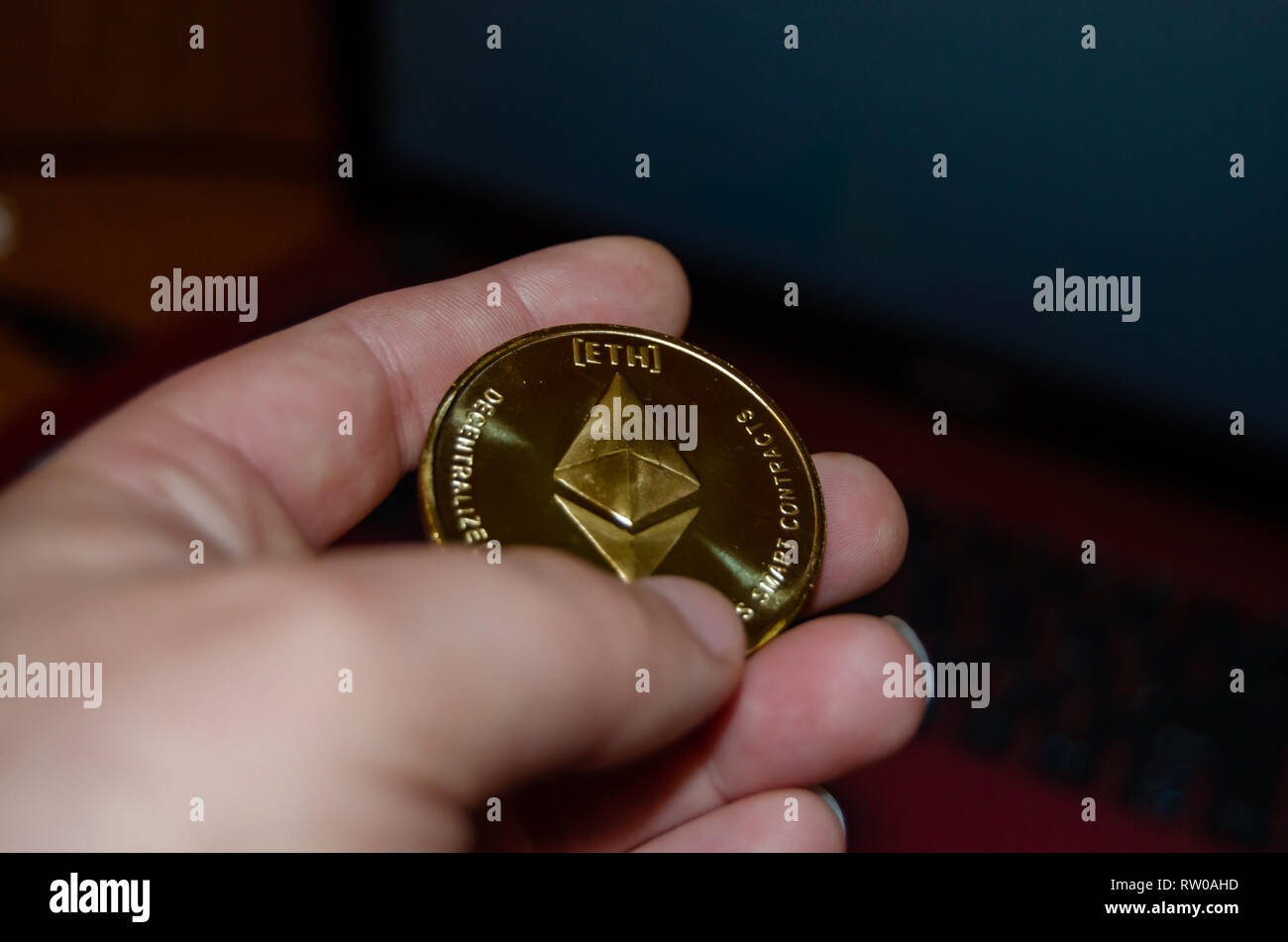 woman hand holding ethereum, close up phisical coin - ethereum ...