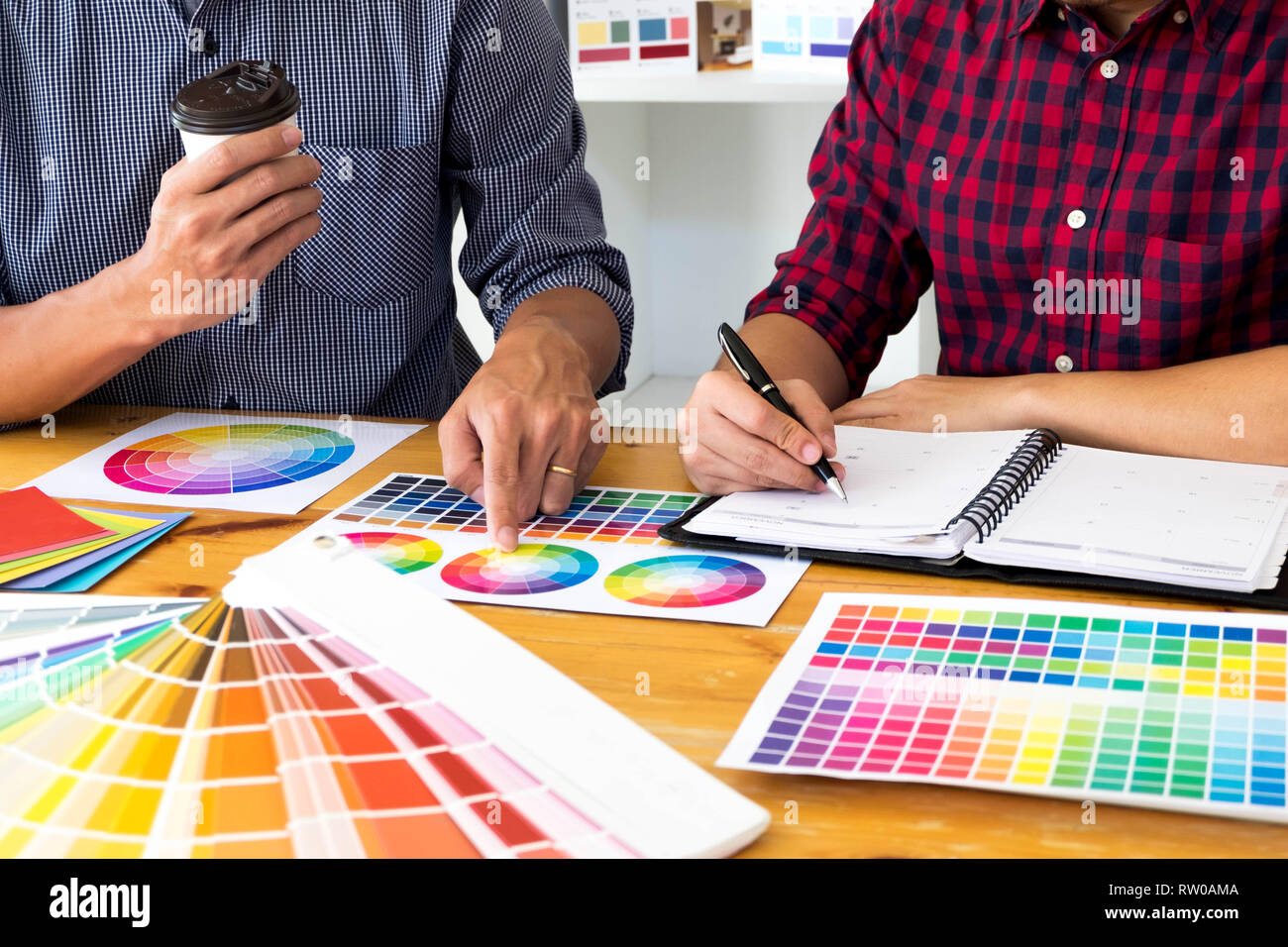Graphic designers choose colors from the color bands samples for design ...