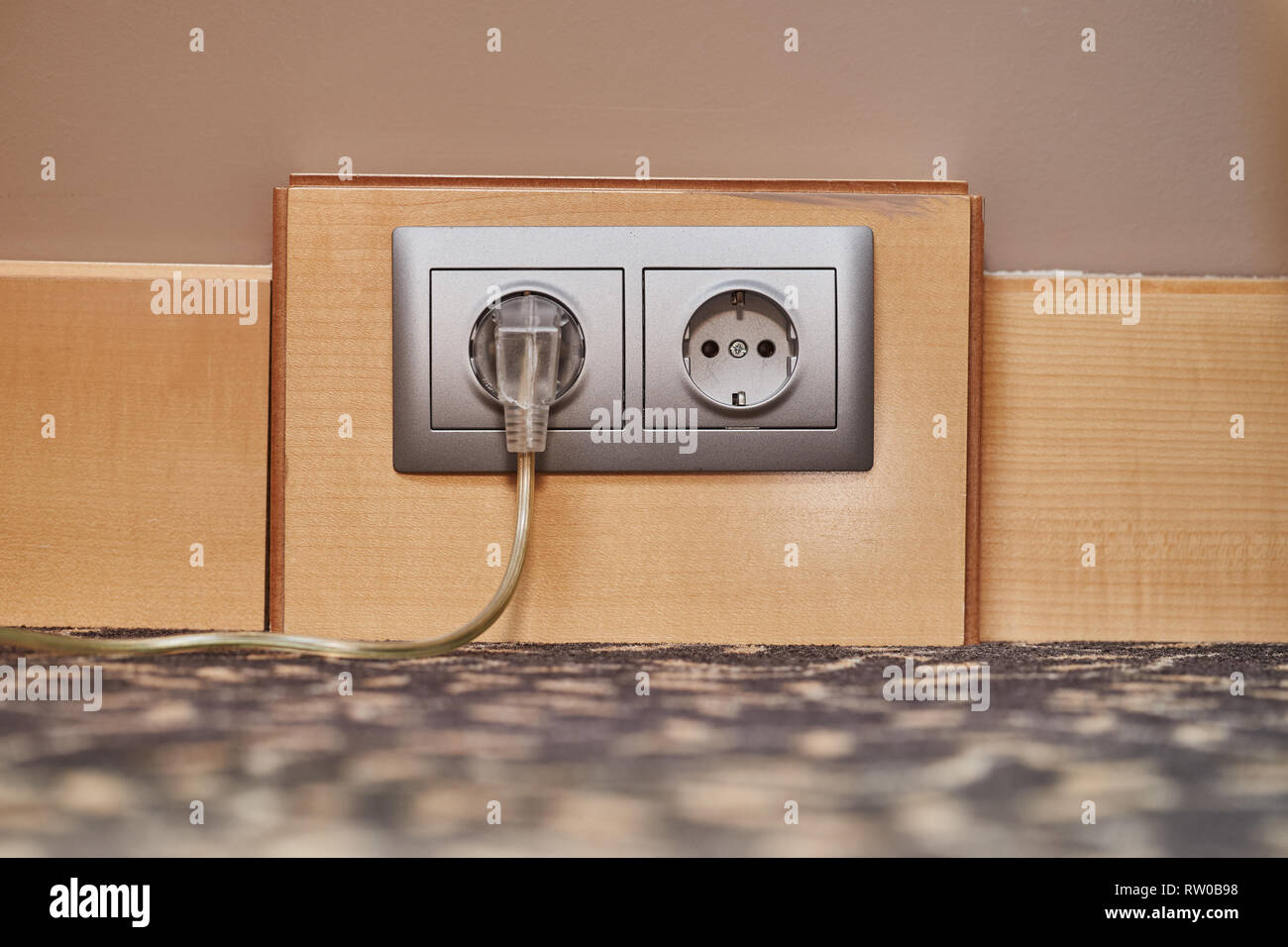 Electric outlet with cable connected Stock Photo - Alamy