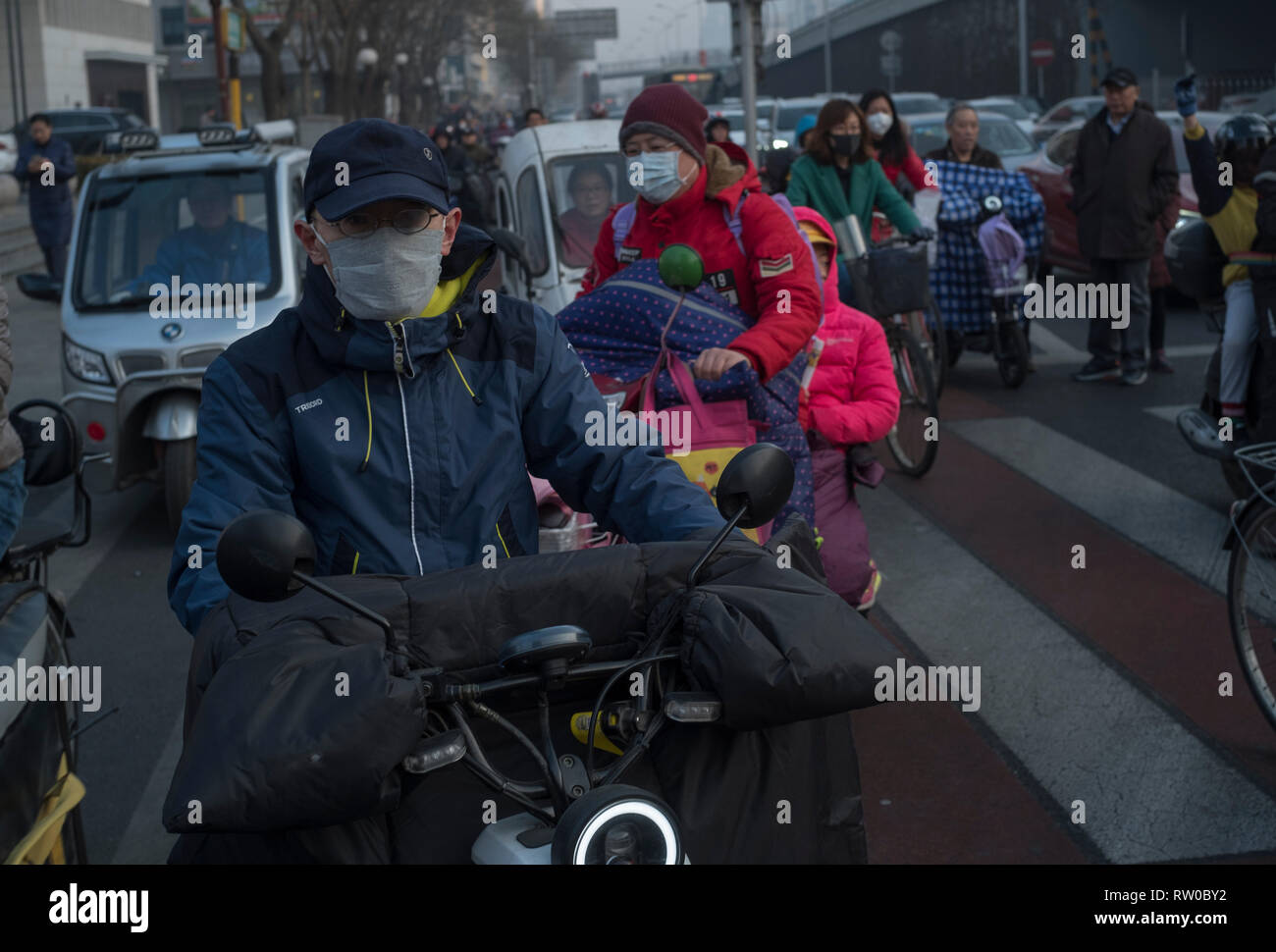 People wear masks in a day of Orange smog alert in Beijing, China. 04 ...