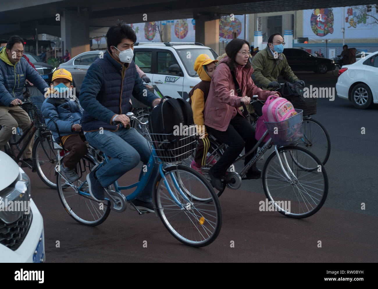 People wear masks in a day of Orange smog alert in Beijing, China. 04 ...