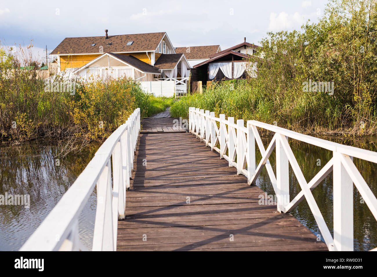 Village, nature and country life concept - long wooden bridge and ...