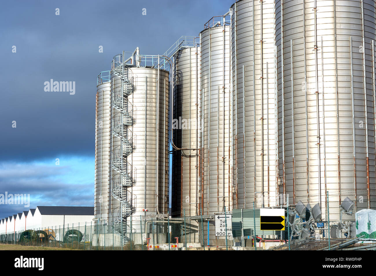large barrels for storage on shore, blue sky Stock Photo - Alamy