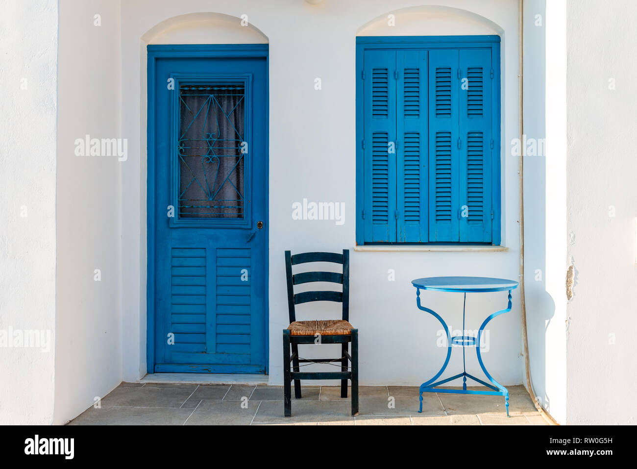 Greek house with blue windows and doors in beautiful Sifnos island ...