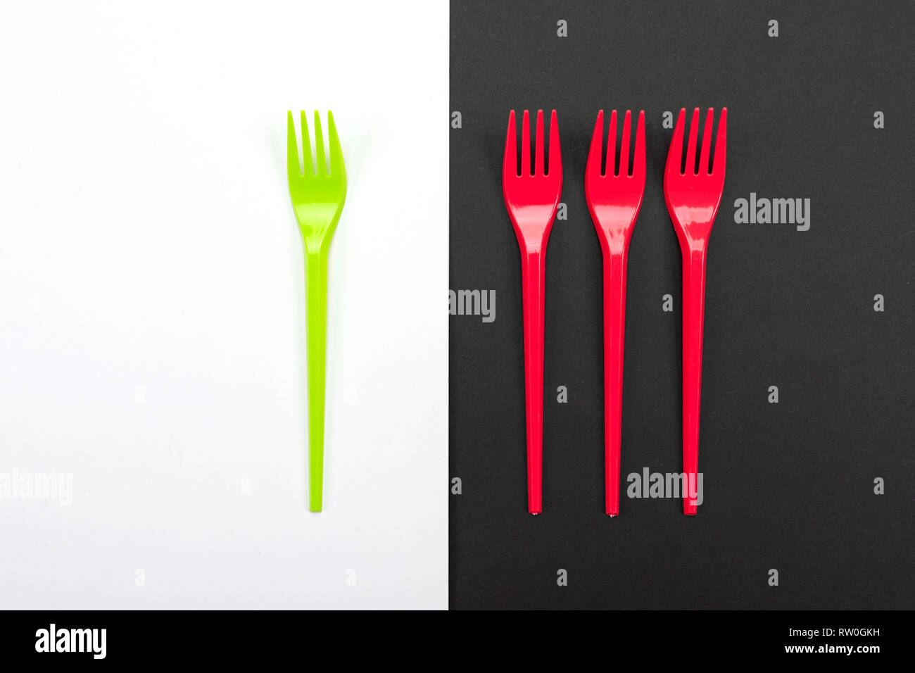 Bright green and red forks isolated on black and white background Stock ...