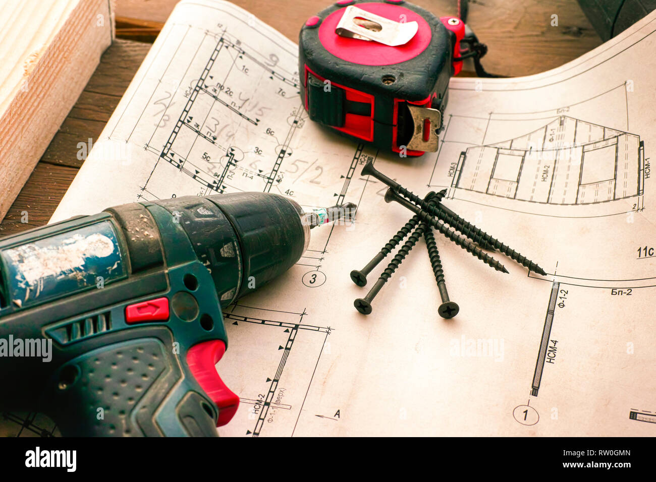 House blueprints with work tools. Close-up Stock Photo - Alamy