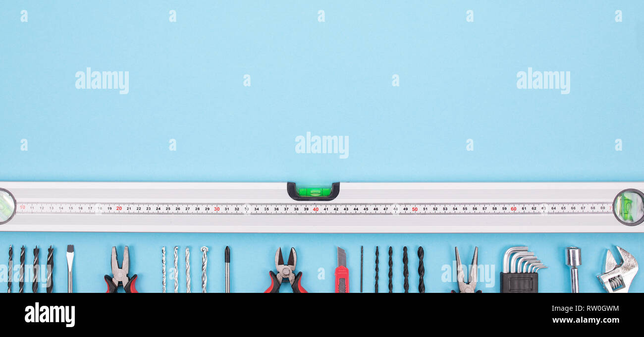 Set of construction tools on red-blue background Stock Photo - Alamy