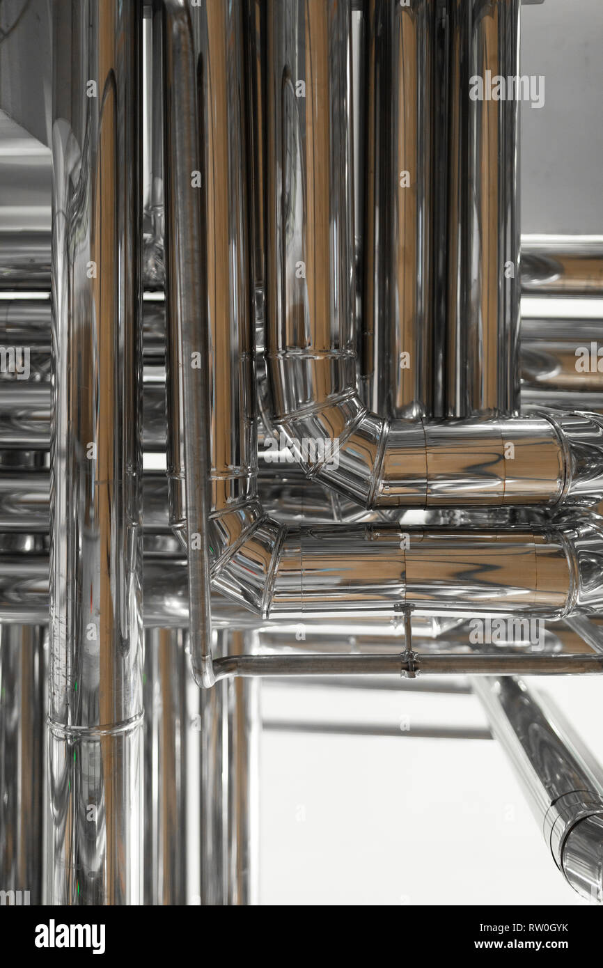Chrome pipes close-up. Industrial background Stock Photo - Alamy