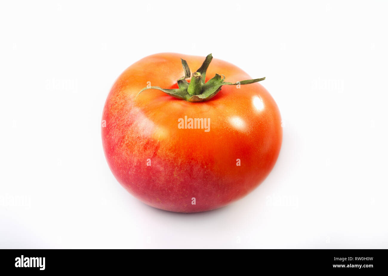 Hybrid of apple and tomato on a white background Stock Photo - Alamy