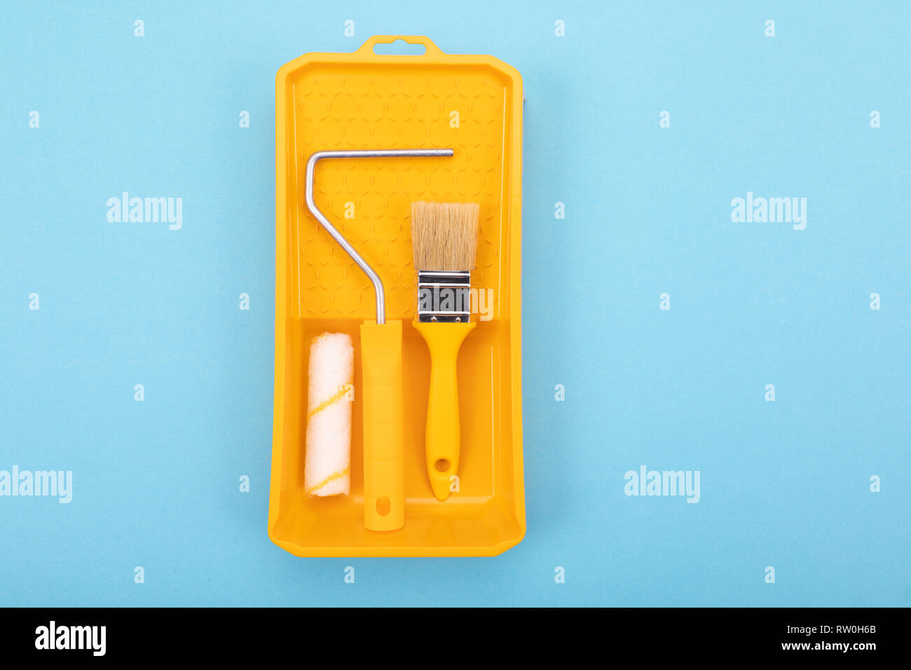 Paint tools. Paint brush and roller with tray for paint. Mock-up Stock ...