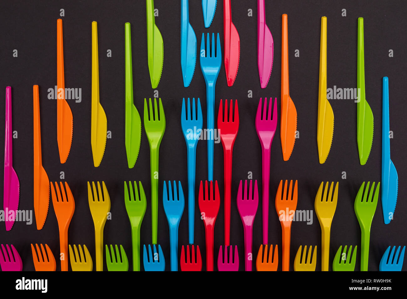 Colorful set of vibrant forks and knife isolated on black Stock Photo ...