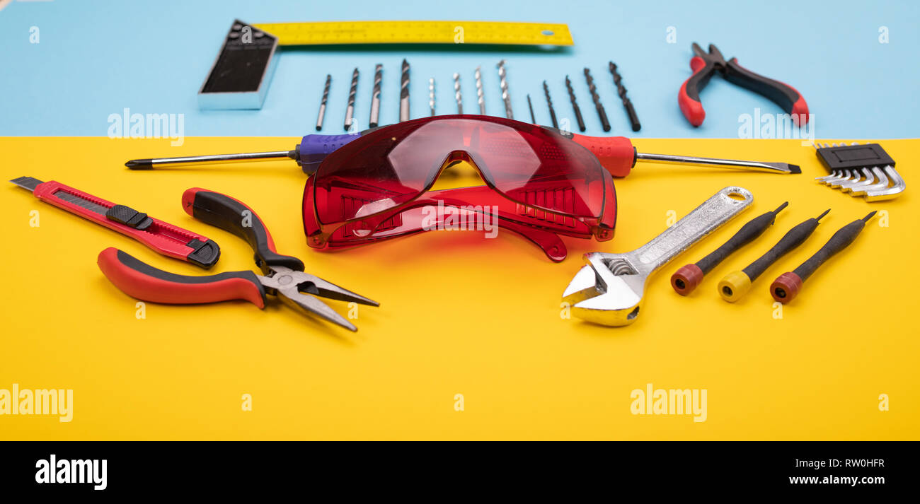 set of metalwork tools on colorful background Stock Photo - Alamy