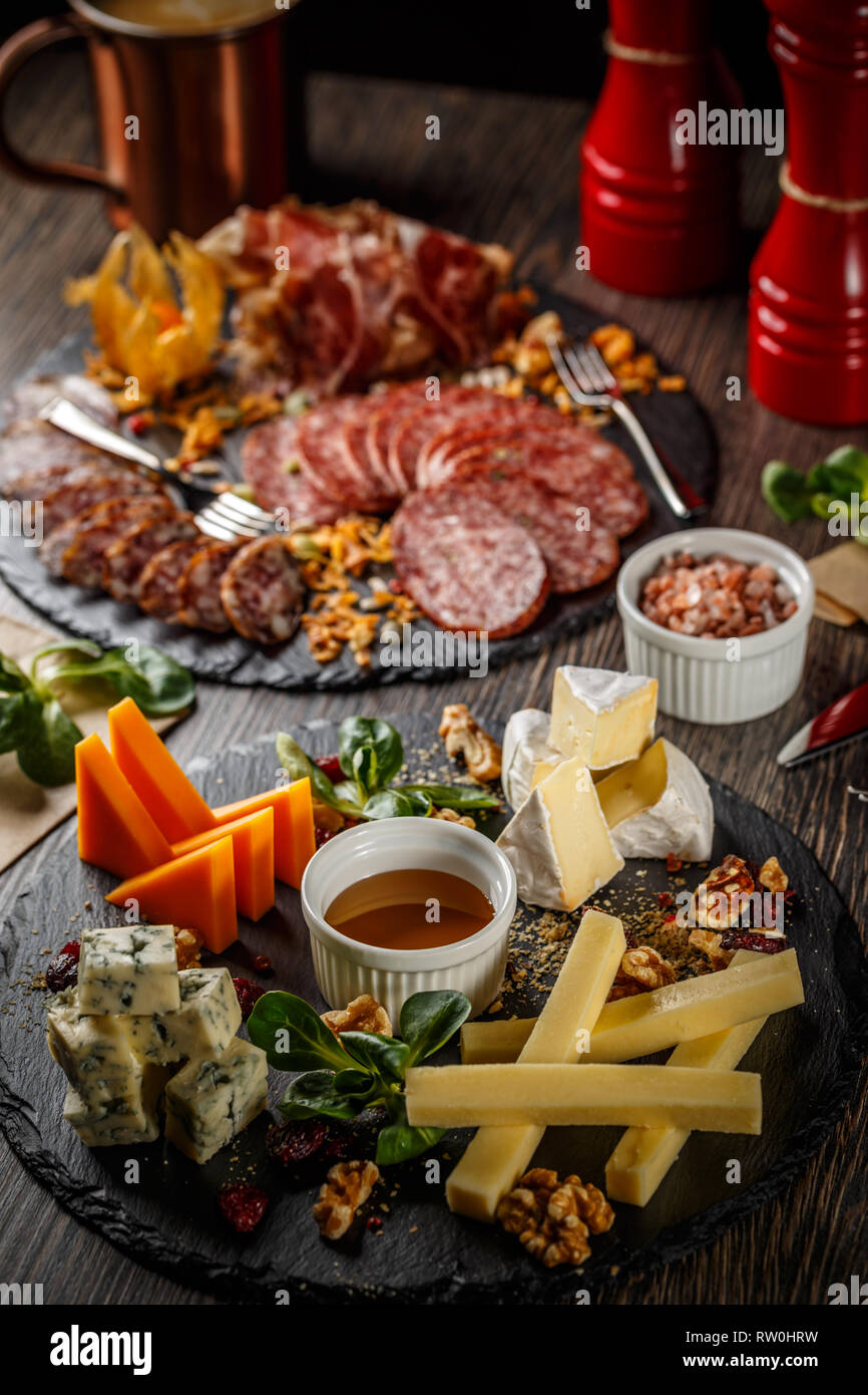 Assortment of italian antipasti, cold cuts and cheese plate Stock Photo ...