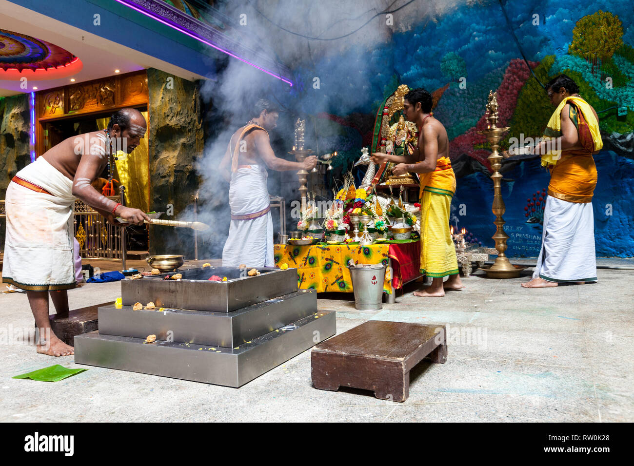 Batu Caves, Hindu Priests Performing Ritual in front of Shrine of ...