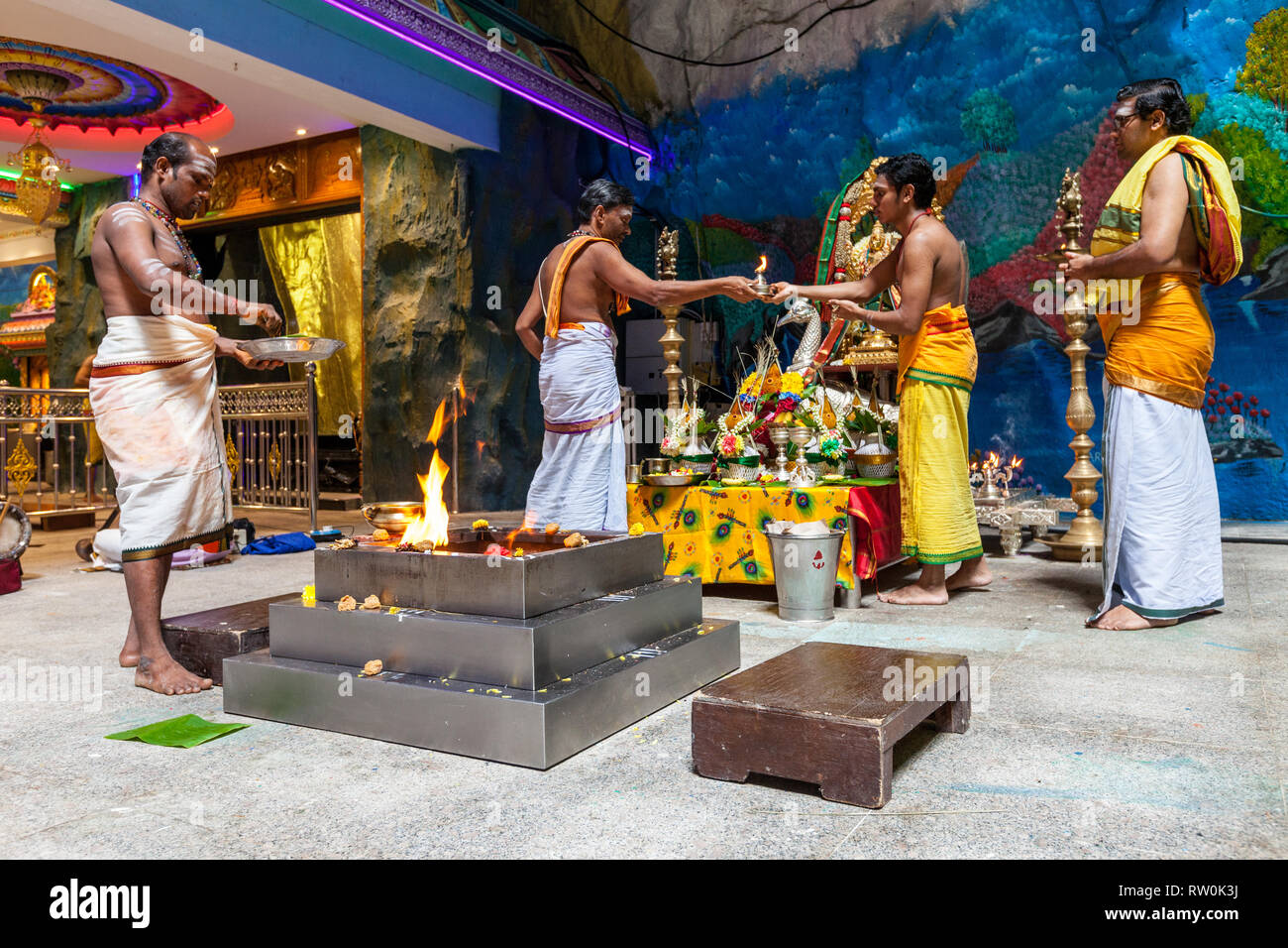 Batu Caves, Hindu Priests Performing Ritual in front of Shrine of ...