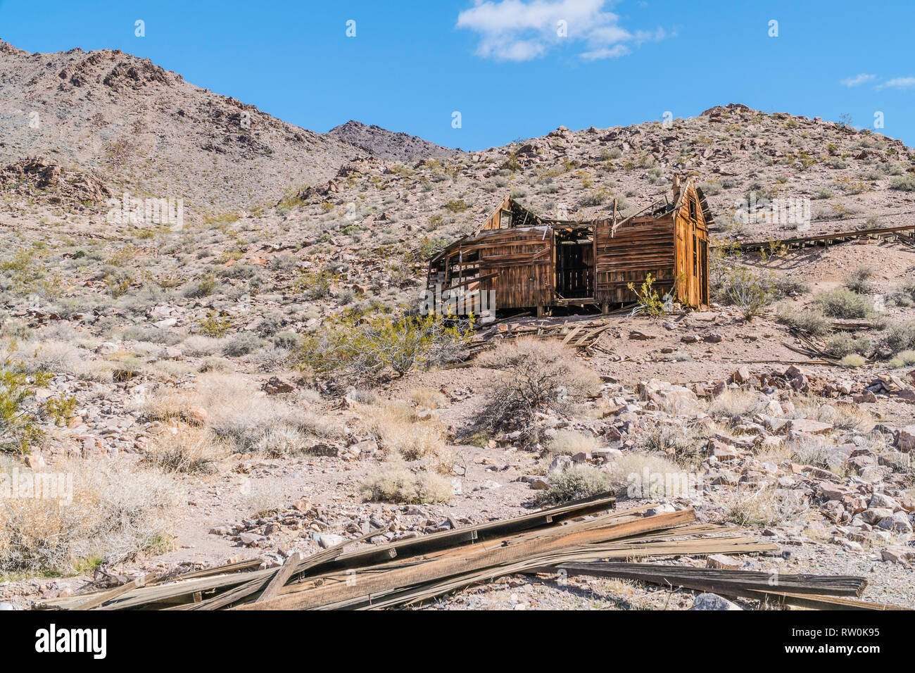 A wooden house with a collapsed roof at the Inyo Mine ruins in Death ...