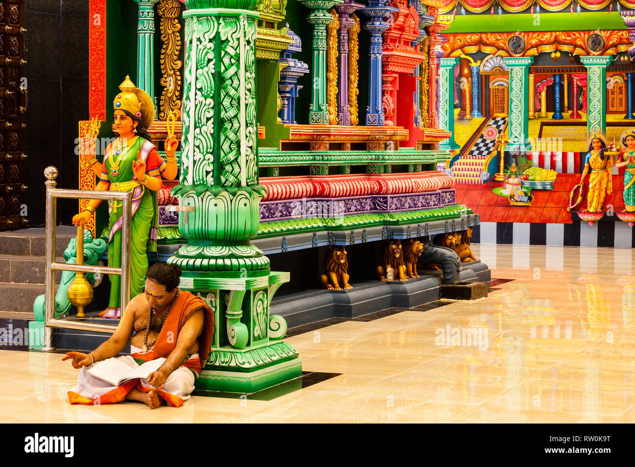 Batu Caves, Hindu Priest Reading in Temple at Base of Steps leading to ...
