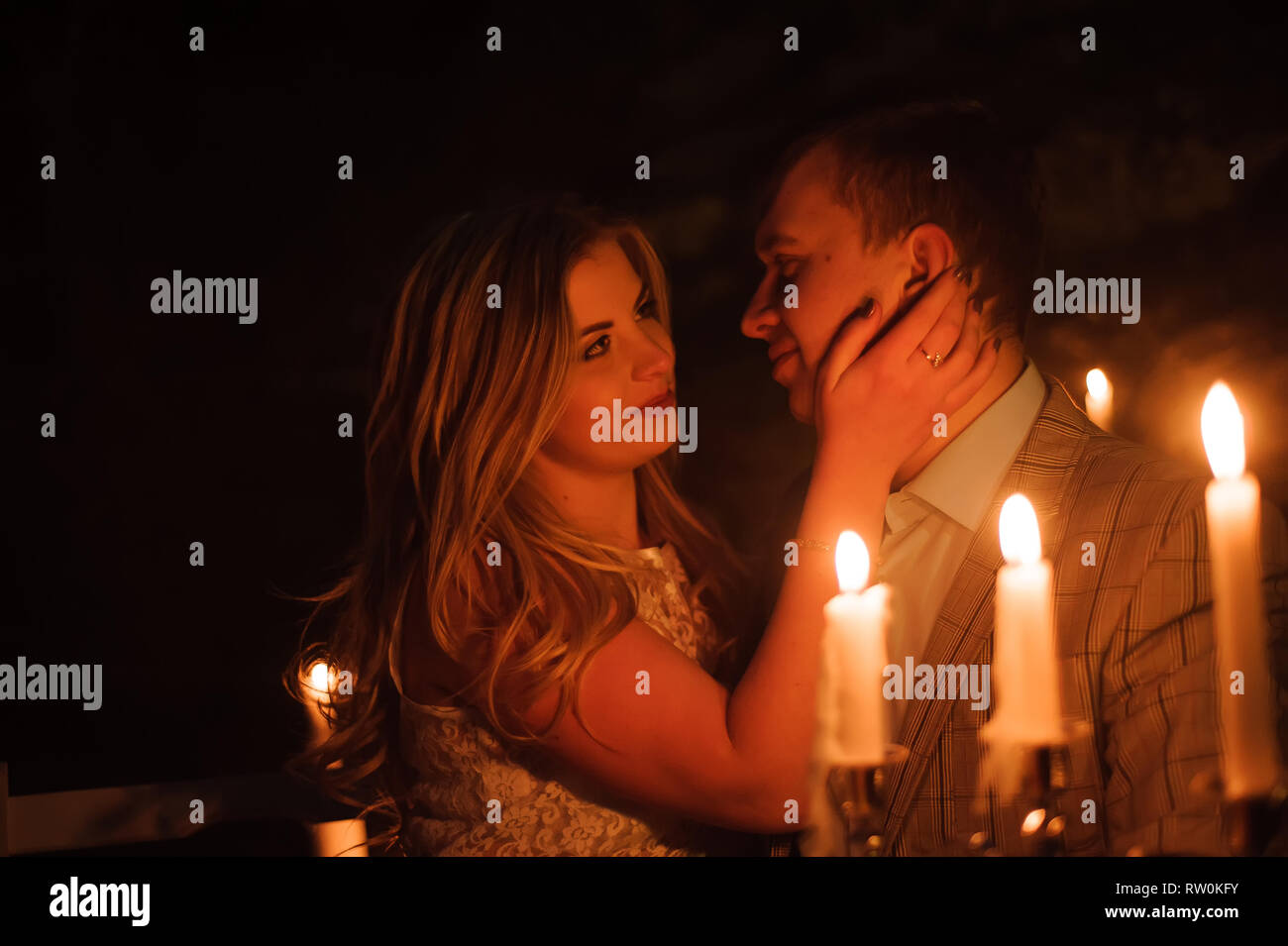 Romantic dinner of a young couple by candlelight in the mountains Stock ...