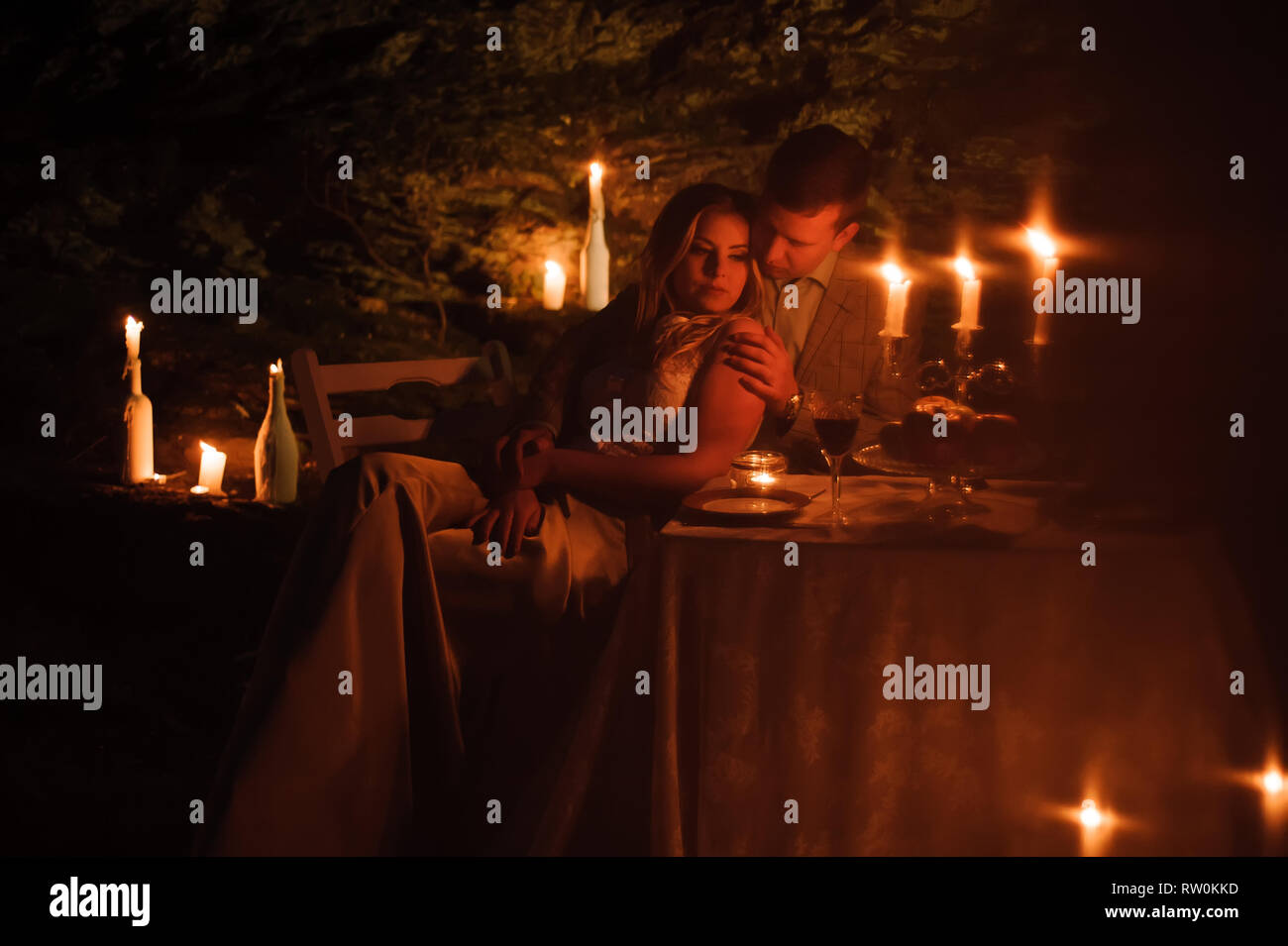 Romantic dinner of a young couple by candlelight in the mountains Stock ...