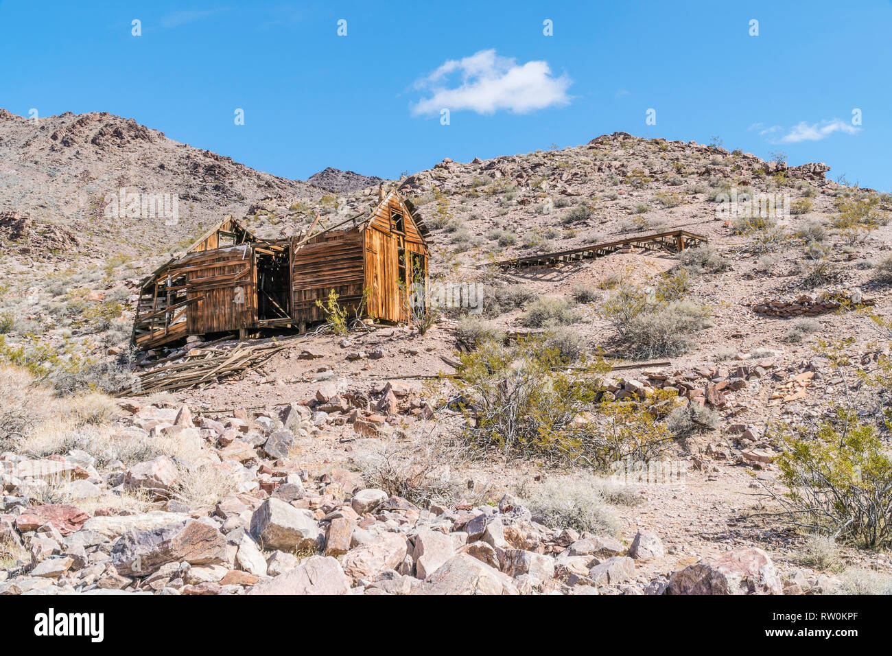 A wooden house with a collapsed roof at the Inyo Mine ruins in Death ...