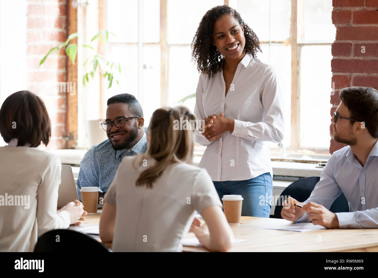 Diverse company staff at modern conference room before seminar Stock ...