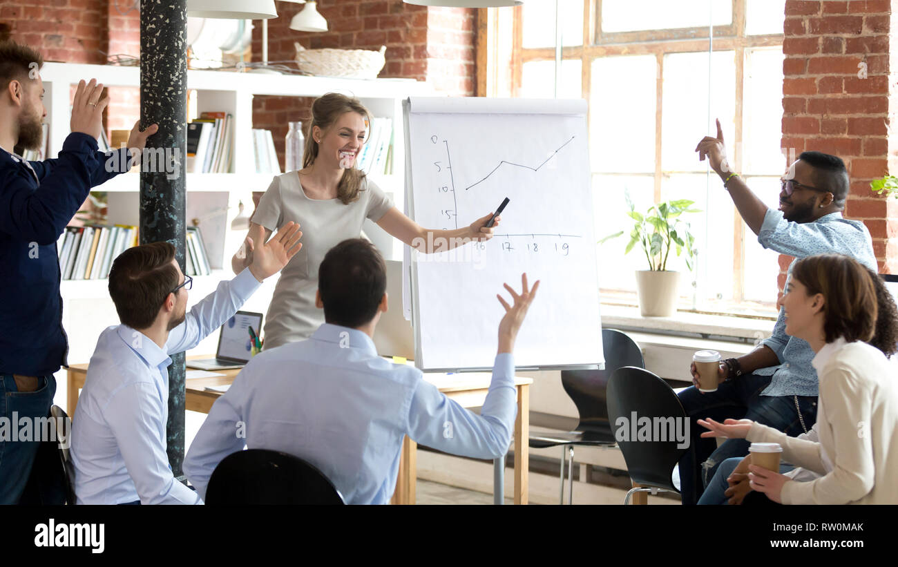 Diverse people voting raising hands during seminar Stock Photo - Alamy