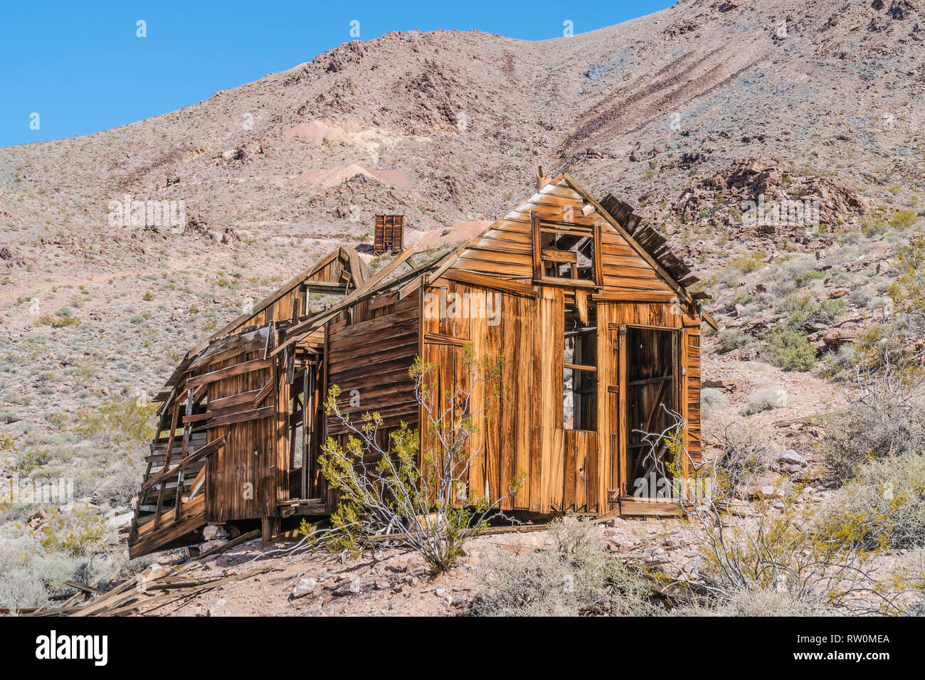 A wooden house with a collapsed roof at the Inyo Mine ruins in Death ...