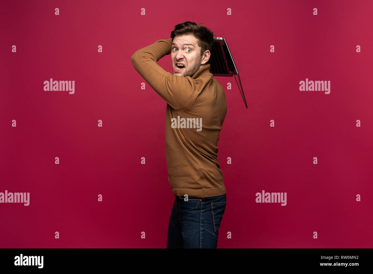 Portrait of angry upset irritated man in casual screaming and holding ...