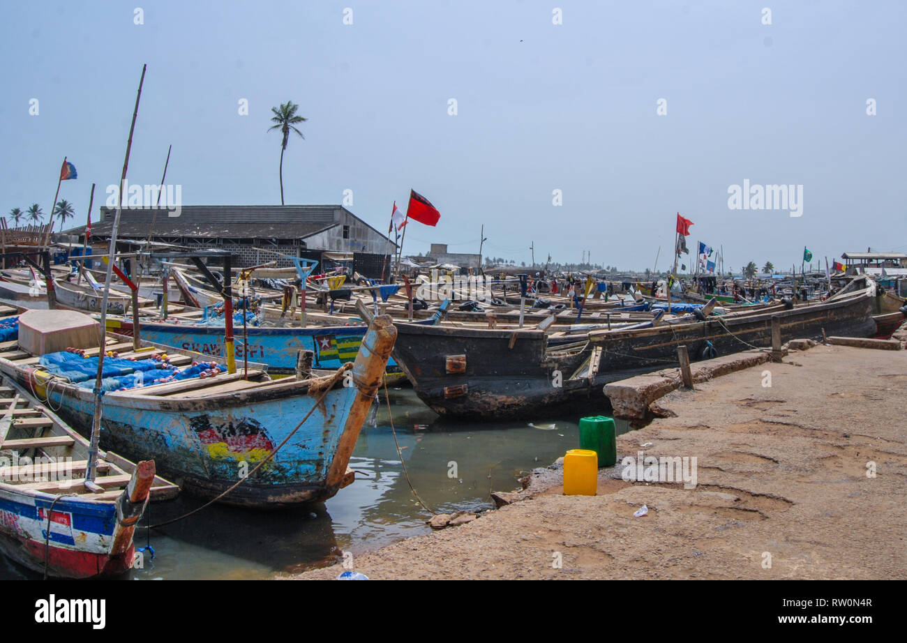 Old and colorful wooden boats docked at the harbour port of the coastal ...