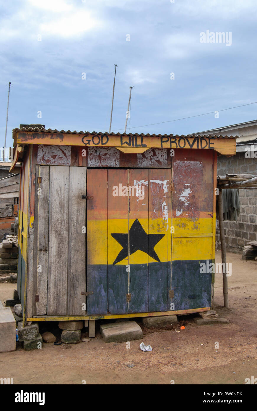 A little shack or hut painted in the colors of Ghanaian flag in the ...
