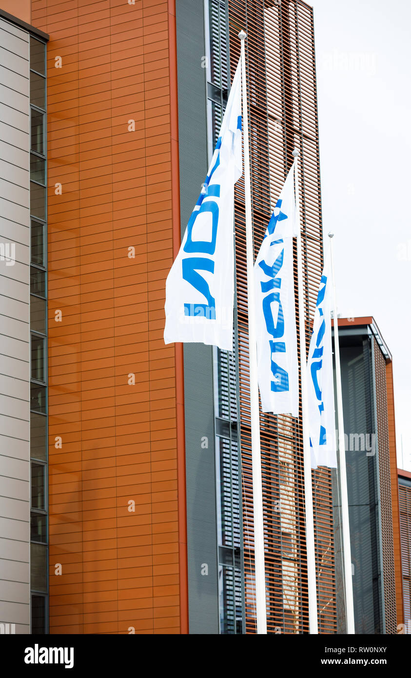 ESPOO, FINLAND - MARCH 03, 2019: White flags with Nokia company name ...